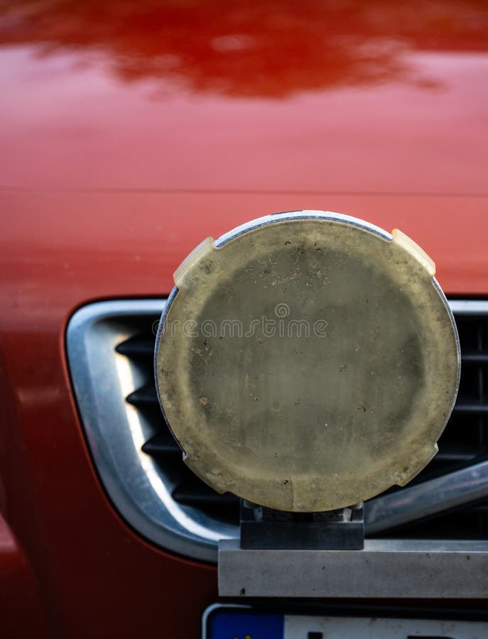 Bleached and Faded Extra Light on the Front of a Red Car.. Stock Photo ...