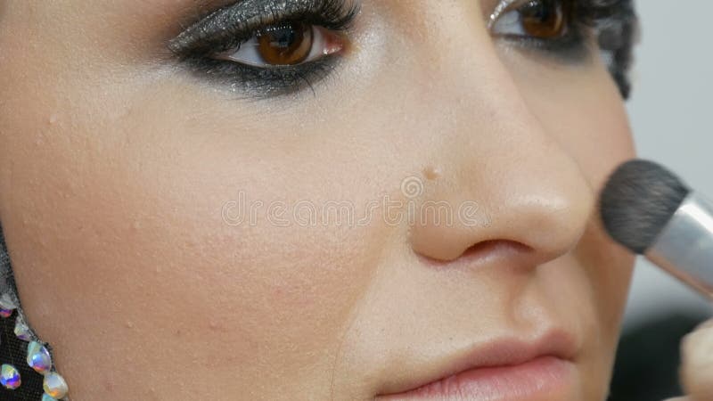 Blendable Highlight with Professional Brush is Applied To the Face of ...