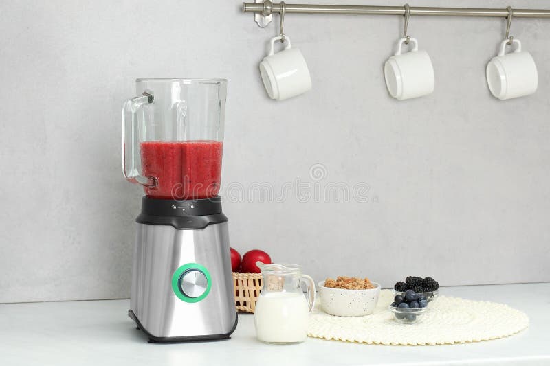 Blender with Mixture of Ingredients and Other Fresh Products on White ...
