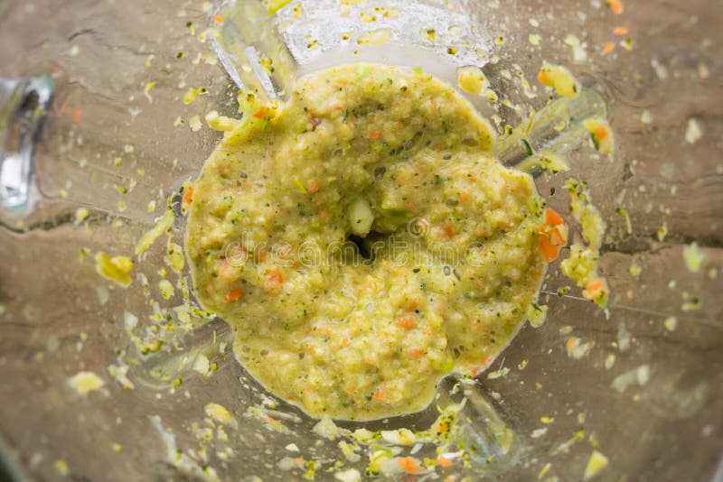 Blender in the Process of Grinding Vegetables on a Wooden Table, Top ...