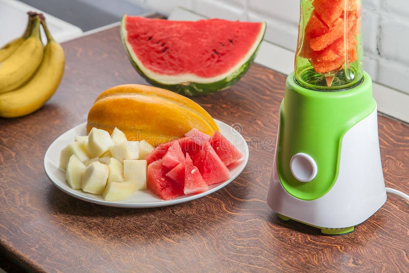Blender with Watermelon, Melon and Bananas Stock Photo - Image of ...