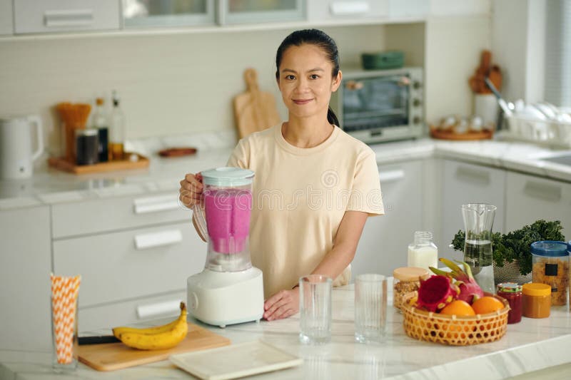 Blending Smoothie in Modern Kitchen Setting with Fresh Ingredients ...