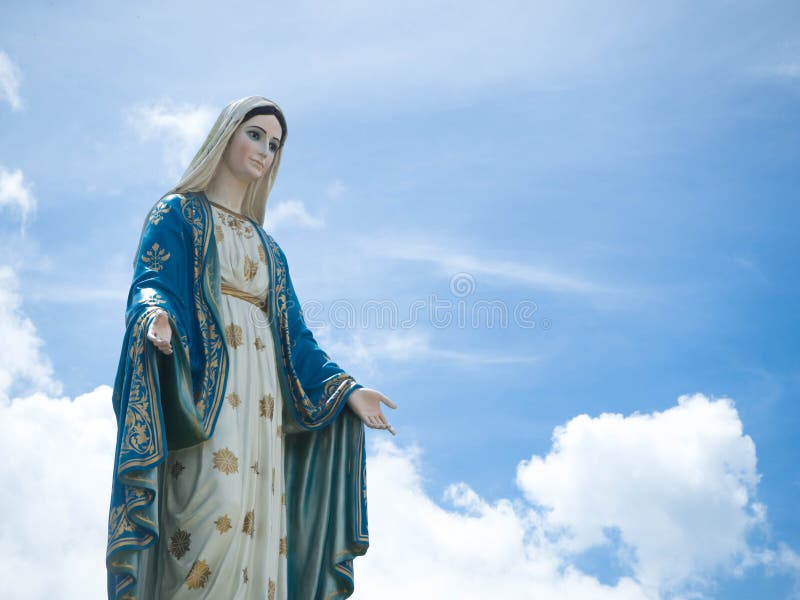 The Blessed Virgin Mary Statue Blue Sky Background. Stock Photo - Image ...