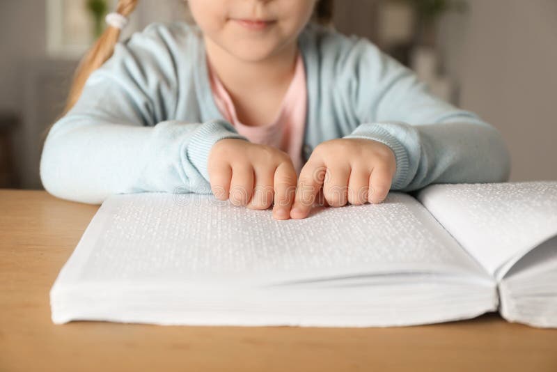 Blind Child Reading Book Written in Braille at Table Stock Photo ...