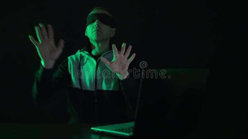 A Blind Man in Front of a Laptop Computer is Blind, Blindfolded Looking ...