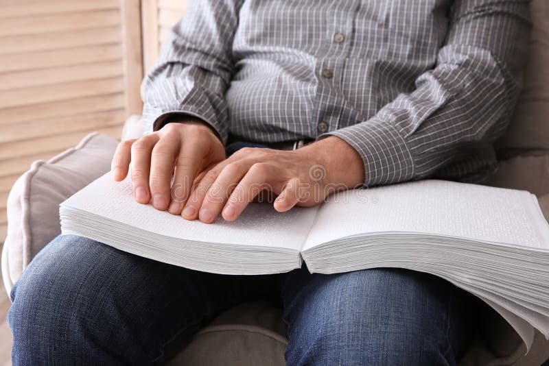 Blind Man Reading Book Written in Braille at Home Stock Image - Image ...