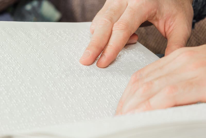 The Blind Man Was Reading a Book Written on Braille. Touch Your Stock ...
