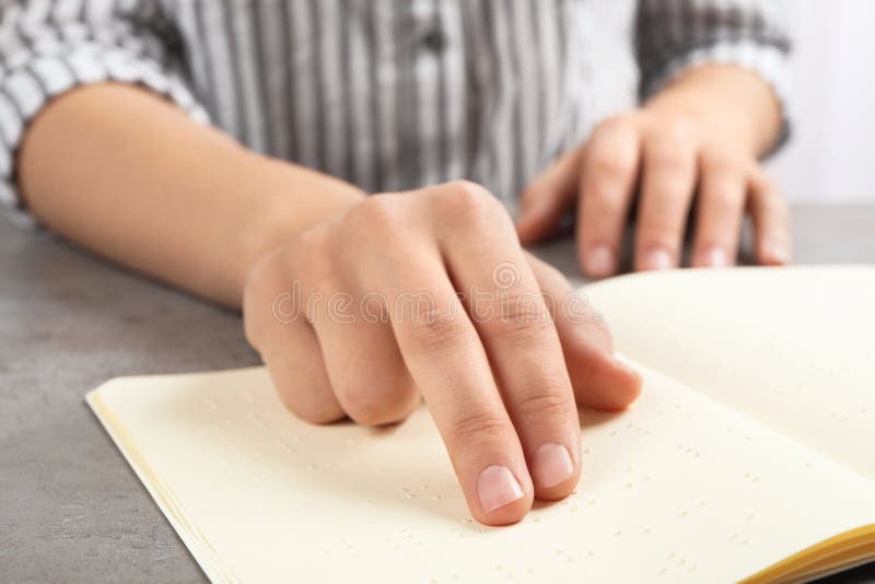 Blind Person Reading Book Written in Braille at Table Stock Image ...
