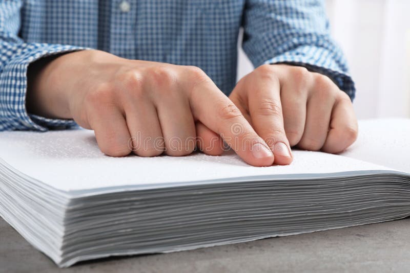 Blind Person Reading Book Written in Braille at Table Stock Image ...