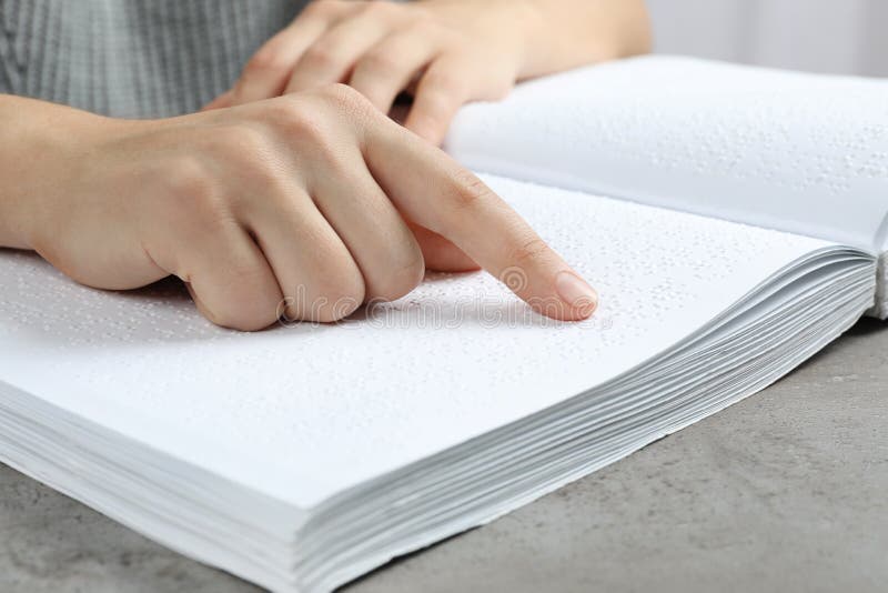 Blind Person Reading Book Written in Braille at Table Stock Image ...