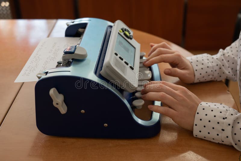 A Blind Woman Uses a Computer with a Braille Display and a Computer ...