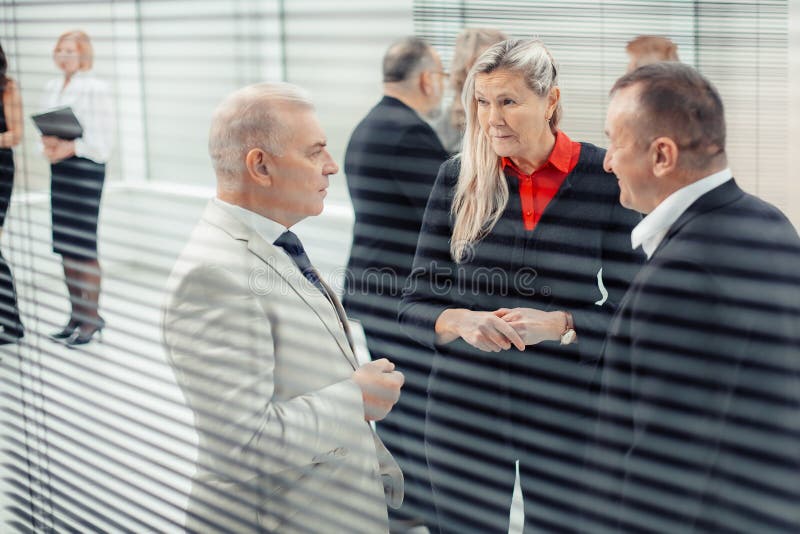 Business Colleagues Talking Standing in the Office Stock Image - Image ...