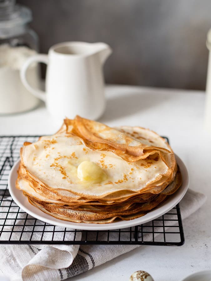 Blini or Crepe or Thin Pancakes Stack on Table Topped with Butter ...