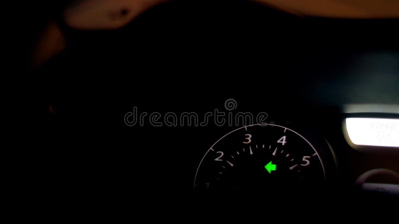 A Blinker or Turn Indicator on the Interior of a Car Green Arrow Shows ...