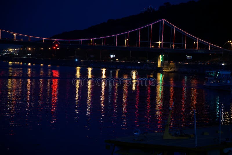 Blinking Lights on Night Bridge, Sparkle in Water Reflection Stock ...