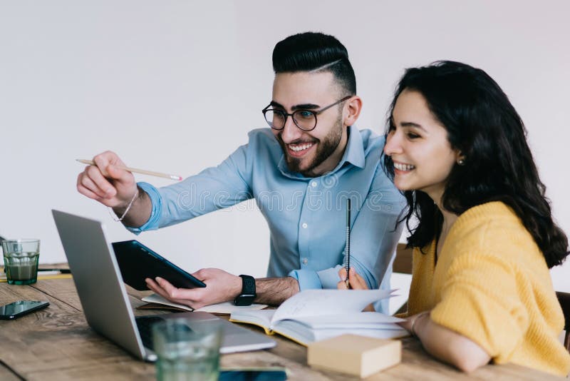 Blissful Couple Writing Notes and Using Gadgets Stock Photo - Image of ...