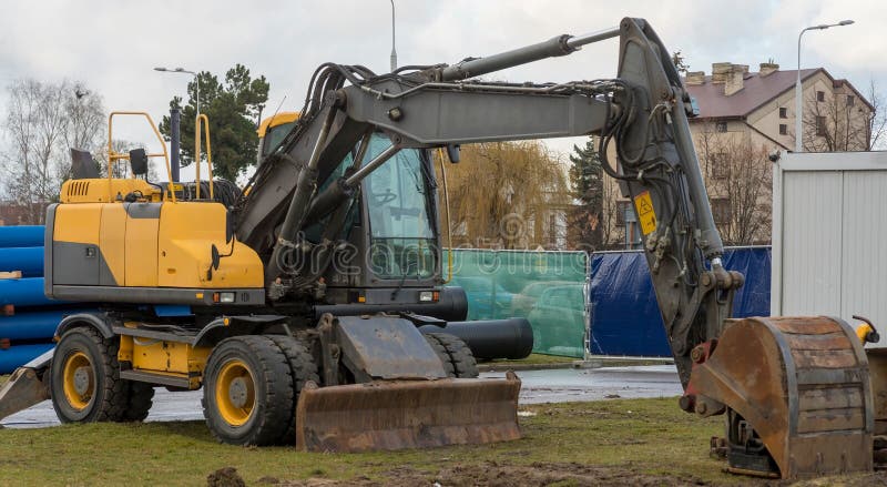 A Large Rotating, Wheeled Excavator at a Construction Site at the End ...