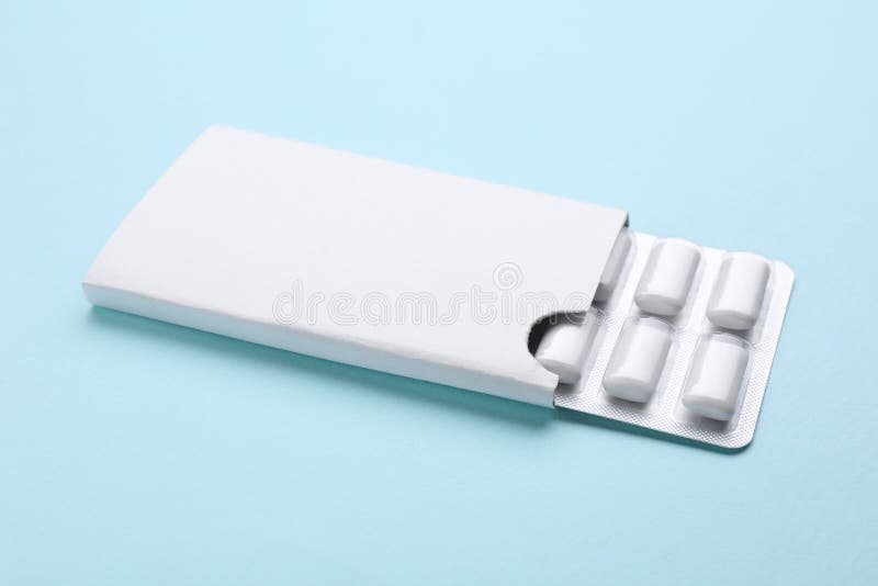 Blister with Chewing Gums on Light Blue Background Stock Photo - Image ...