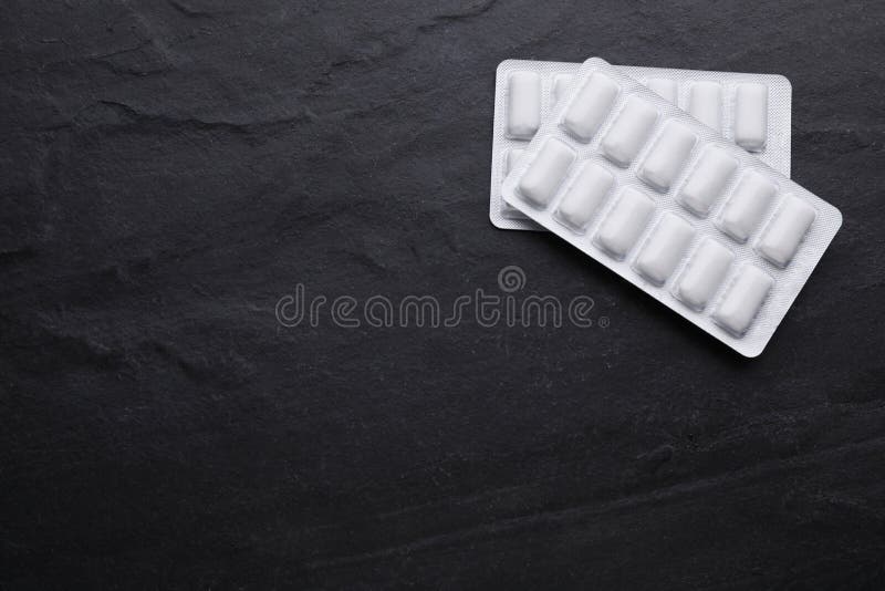Blisters with Chewing Gums on Black Table, Top View. Space for Text ...
