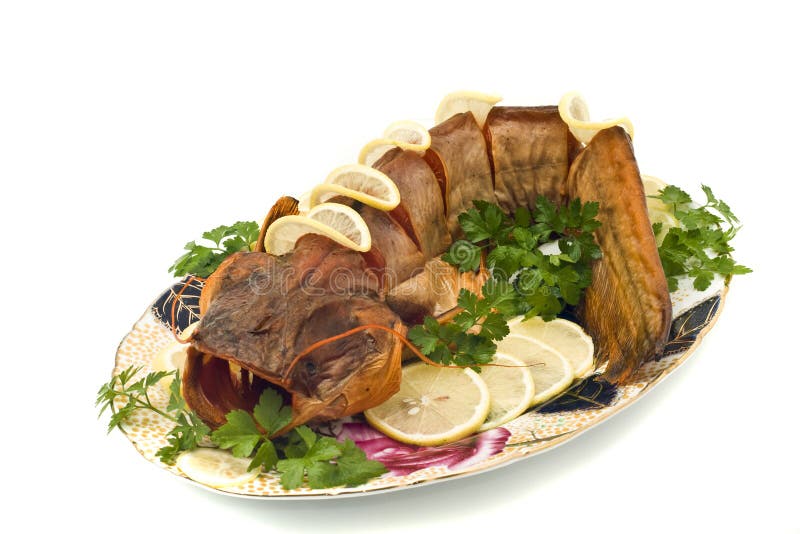 Bloated Fresh-water Catfish (sheatfish) with Lemon Stock Image - Image ...