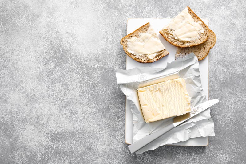 Block of Butter with Butter Knife in a Open Pack. Buttering Bread Stock ...
