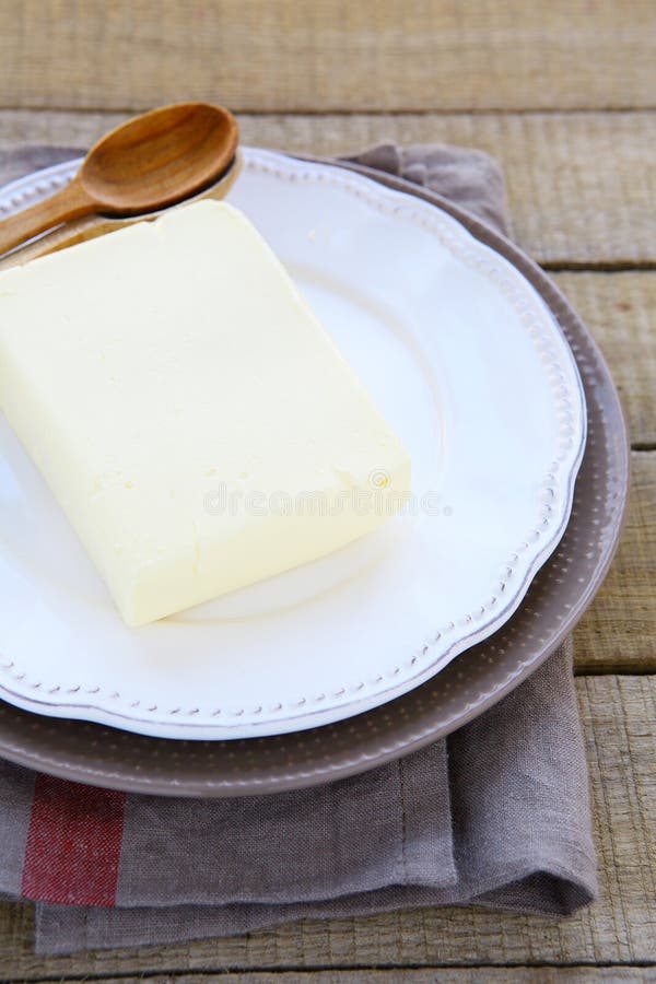 Block of butter on a plate stock image. Image of margarine - 37989209