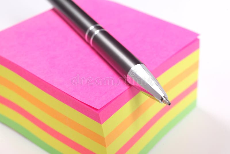 Block of Colored Sticky Notes and a Pen Isolated on White Background ...