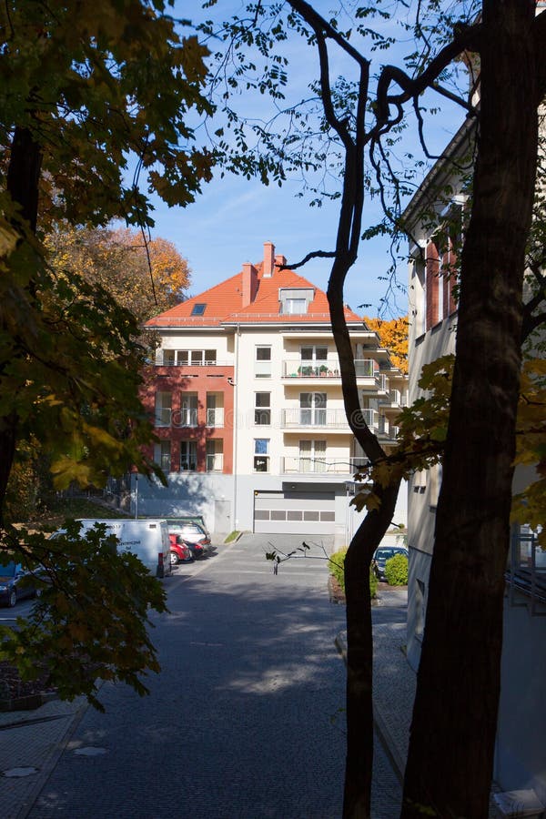 Block of flats in the park stock photo. Image of road - 35674538