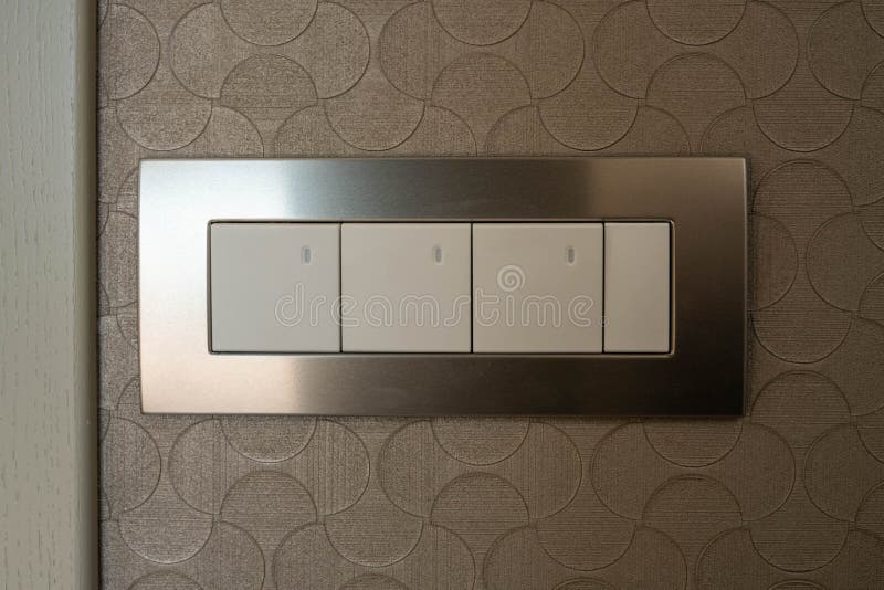 A Block of Four Switches in a Metal Frame. Illumination on the Switch ...