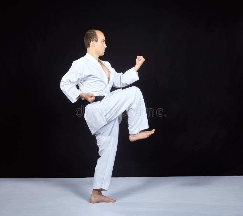 Block by Hand and Blow Leg is Training the Athlete in Karategi Stock ...