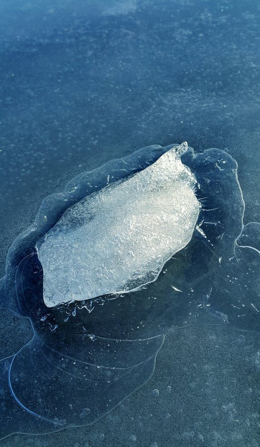 Block of Ice on the Surface of a Frozen River Stock Photo - Image of ...
