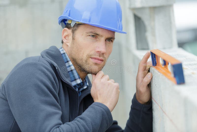 Block Layer Using Spirit Level Stock Photo - Image of wall, aligning ...
