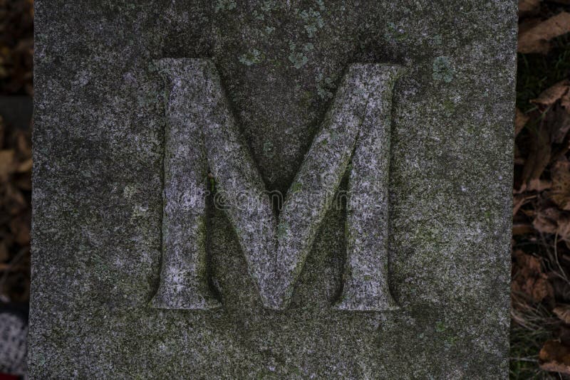 Block with Letter M. Embossed on the Stone Surface or Concrete Stock ...