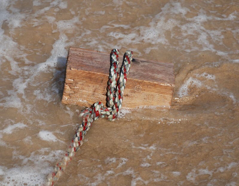 Block on Rope in Water stock photo. Image of wooden, seas - 46720060