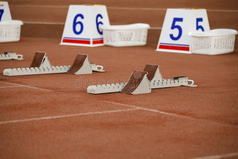 Arranged Starting Blocks, Lane Numbers and Cloth Baskets Stock Image ...