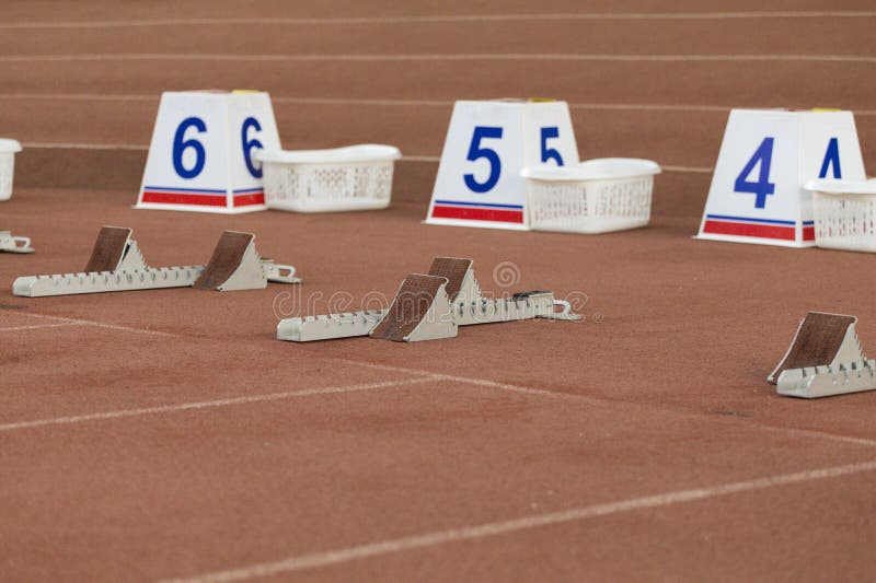 Arranged Starting Blocks, Lane Numbers and Cloth Baskets Stock Image ...