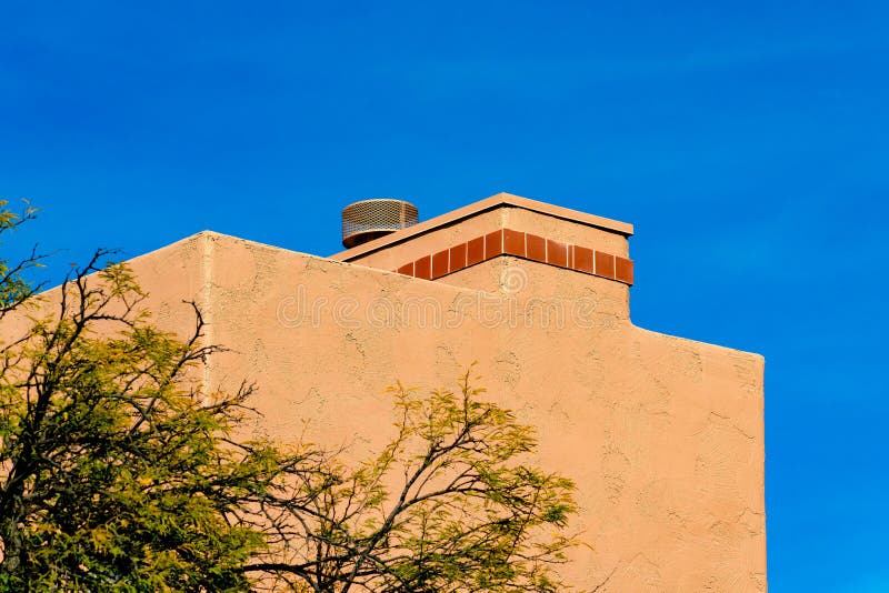 Block Style Chimney on an Adobe House with Tiny Red Tiles or Bricks on ...