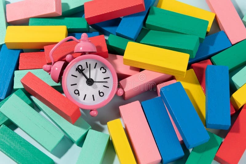 Block Tower Made of Colourfull Wooden Blocks and a Clock Stock Photo ...