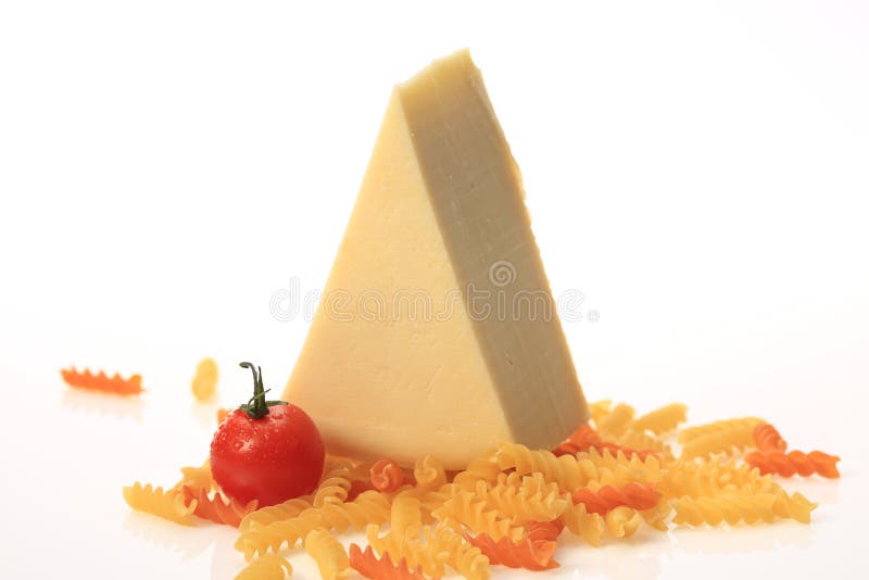 Block and Triangle Sliced Cheese with a Slice of Tomato Stock Photo ...