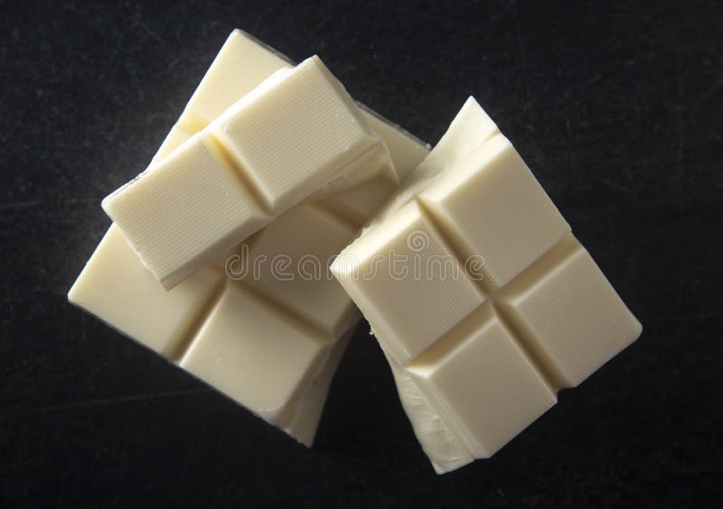 Block of White Chocolate on a Dark Kitchen Cabinet Stock Image - Image ...