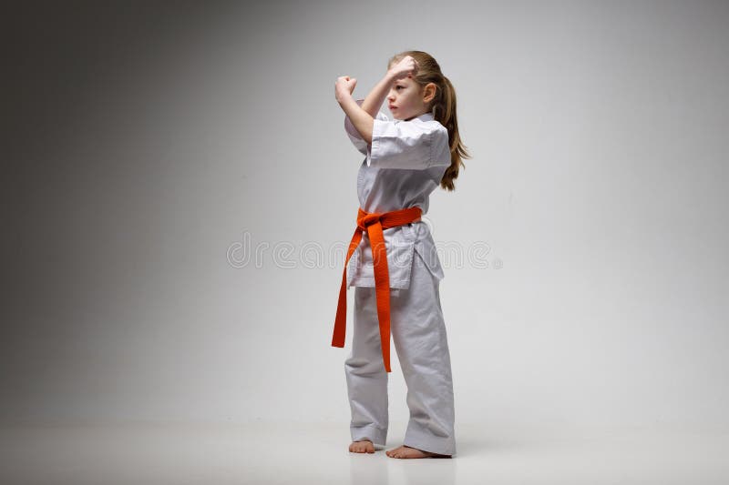 Greeting Little Girl in Karate, Position of the Student on a White ...