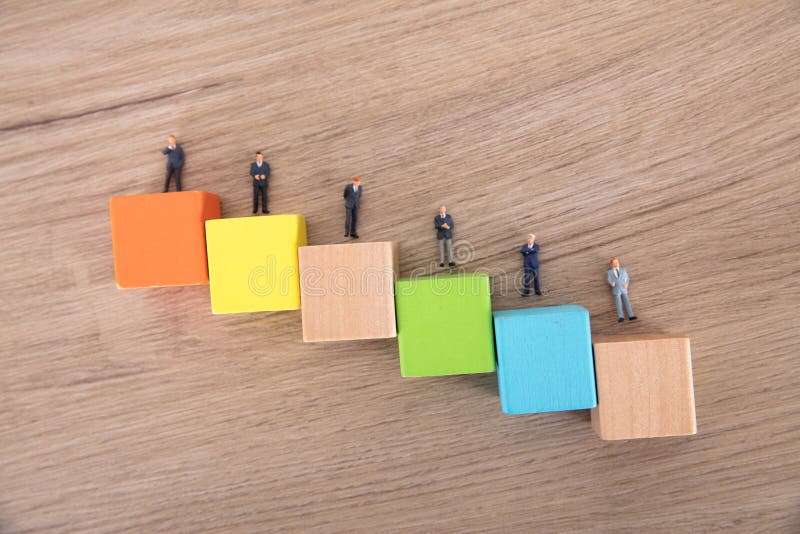 Blocks of Building Blocks and Tiny Figures Gradually Moving Down Stock ...