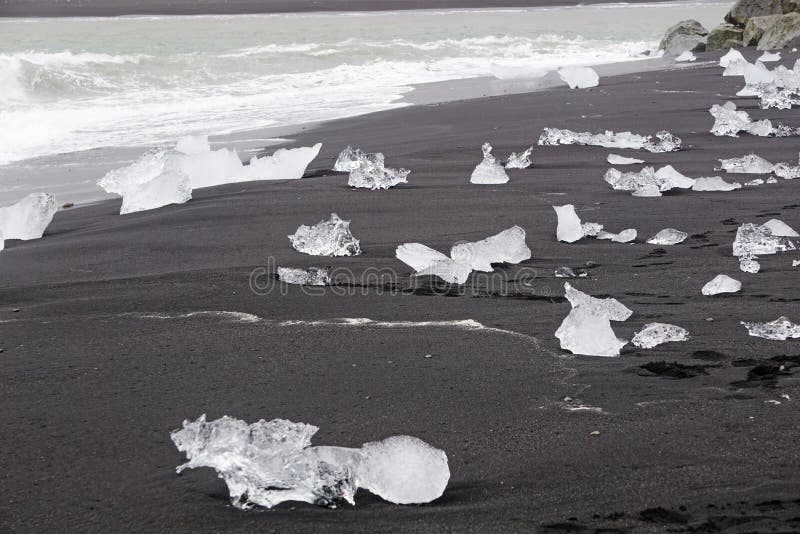 Blocks of Ice on Black Sand - Diamond Beach in Iceland Stock Photo ...