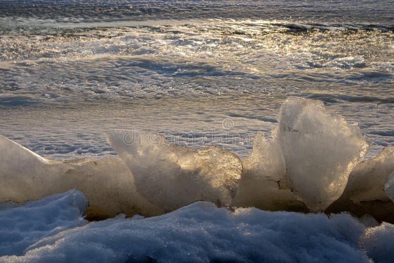 Blocks of ice on sea shore stock image. Image of coastline - 356468875