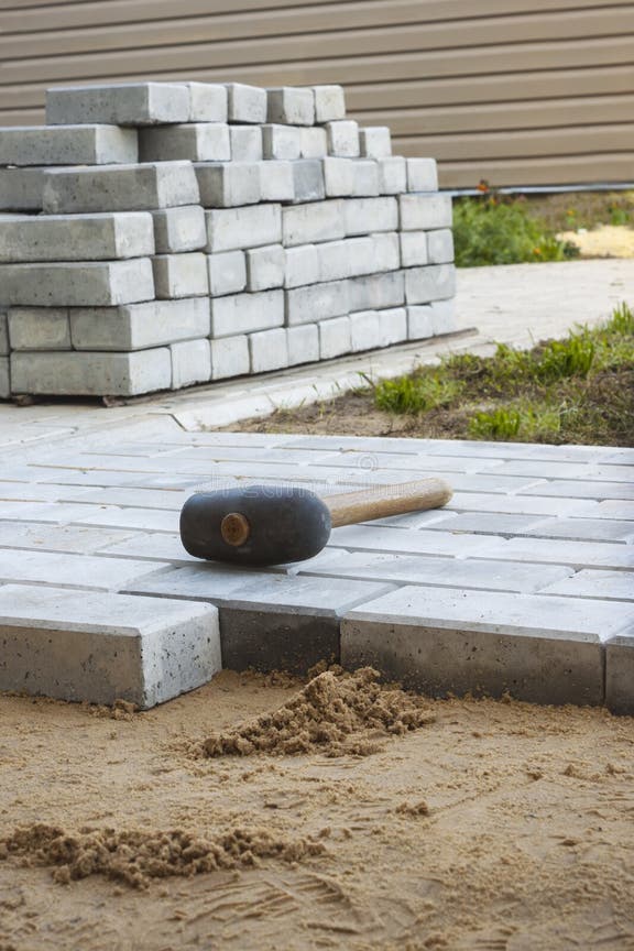 Blocks Laying is on Sand Base. Patio Device Stock Photo - Image of pave ...