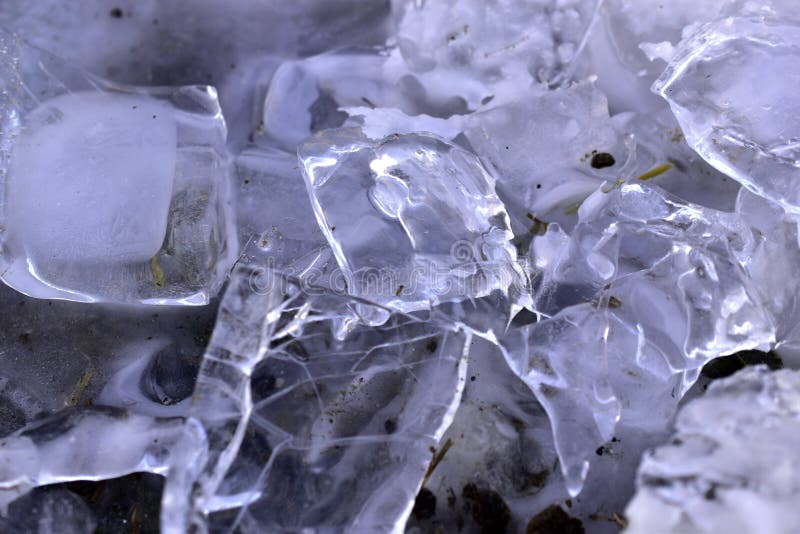 Blocks of Multicolored Transparent Ice in Winter with Mud Stock Photo ...