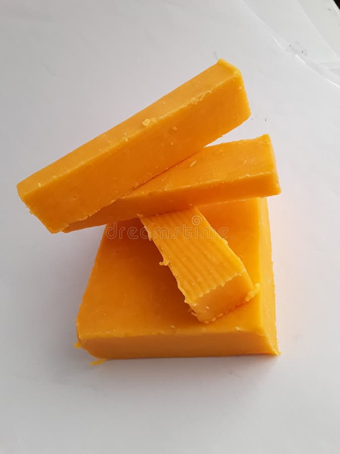 Blocks of Orange Cheddar Cheese Isolated on a White Background Stock ...