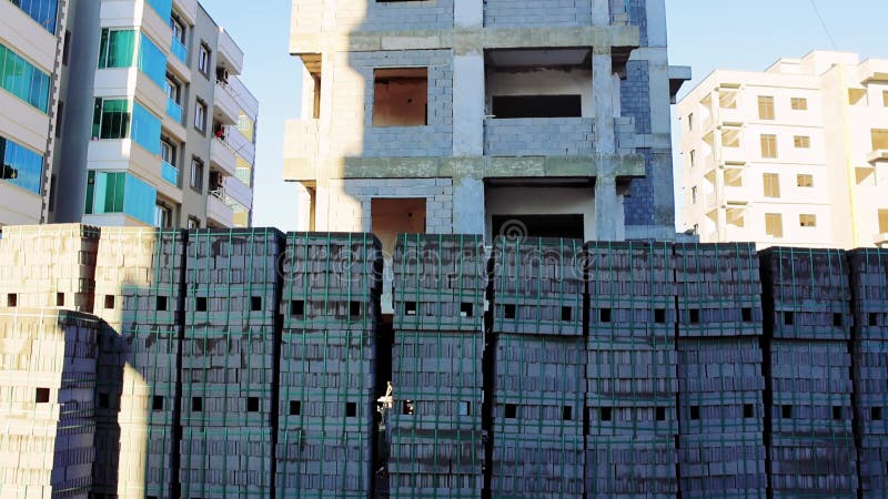 Blocks Piled on Pallets at Construction Site, Camera Shows Large Stack ...