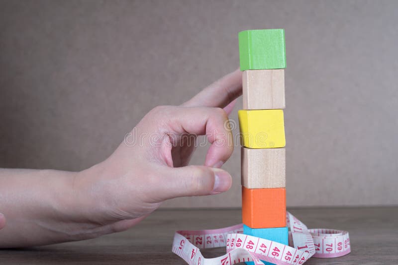 Blocks Stacked Up by Flicking by Hand Stock Image - Image of lowering ...