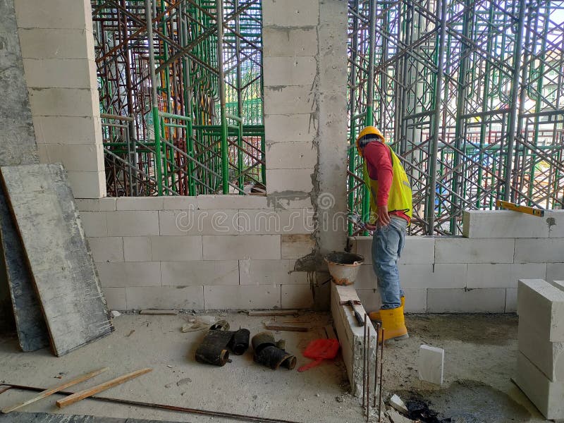 Blockwork by Construction Workers at the Construction Site. Editorial ...